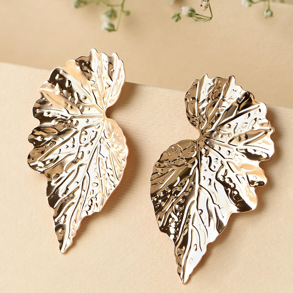 Buy TONIQ Textured Leaf-Shaped Earrings from Toniq at just INR 449.0