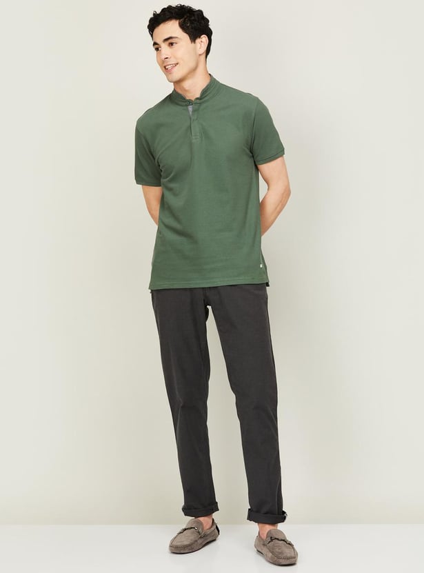 Buy CODE Solid Regular Fit T-shirt from CODE at just INR 999.0