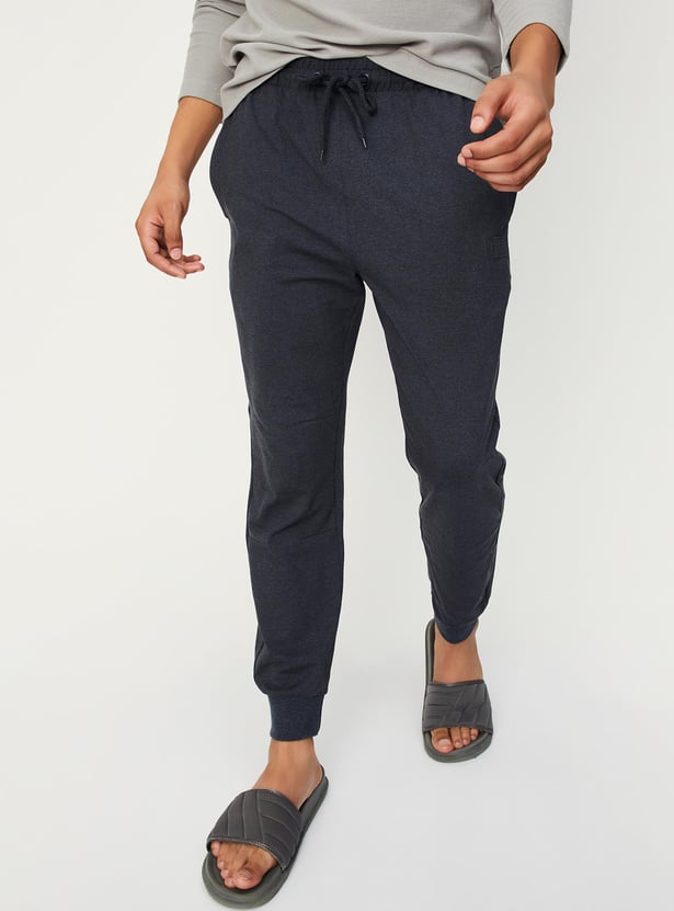 Buy Men Solid Elasticated Joggers Online at just Rs. 699.0 ...