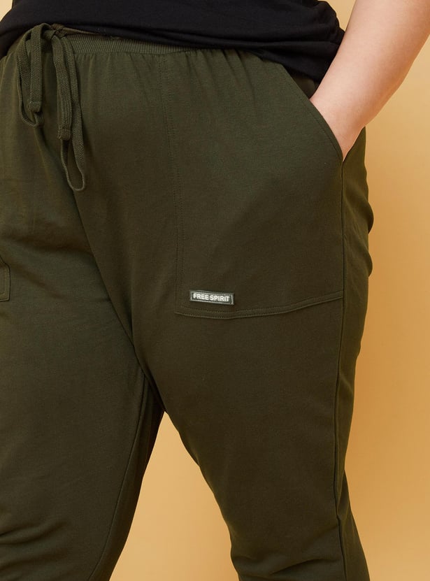 Buy Women Solid Elasticated Sports Capris Online at just Rs. 699.0 ...